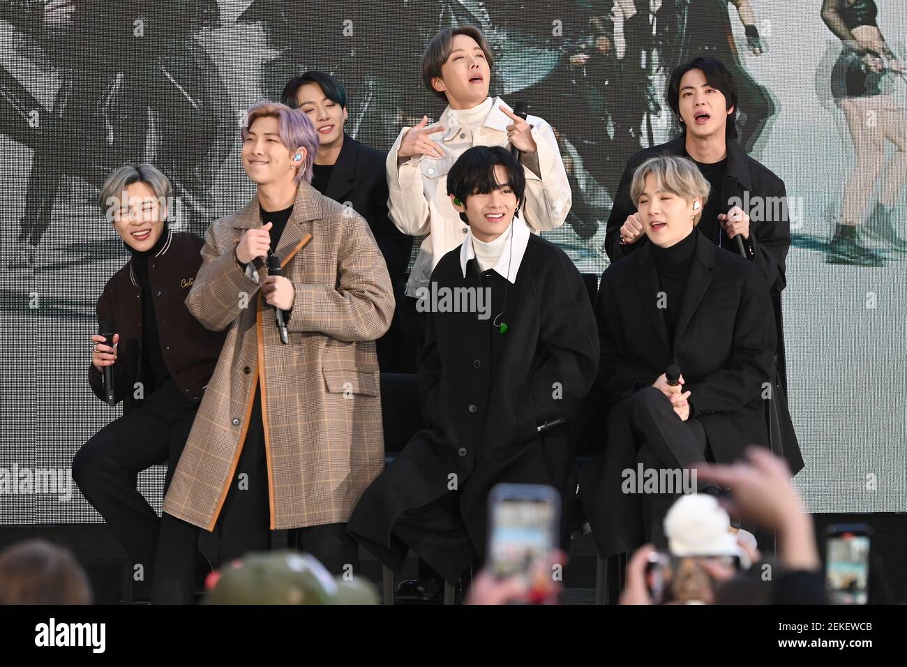 Members of the K-pop band BTS are seen on stage during a live interview ...
