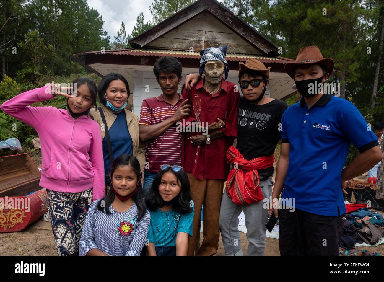 (EDITOR’S NOTE: Image depicts death) Family members pose with the ...