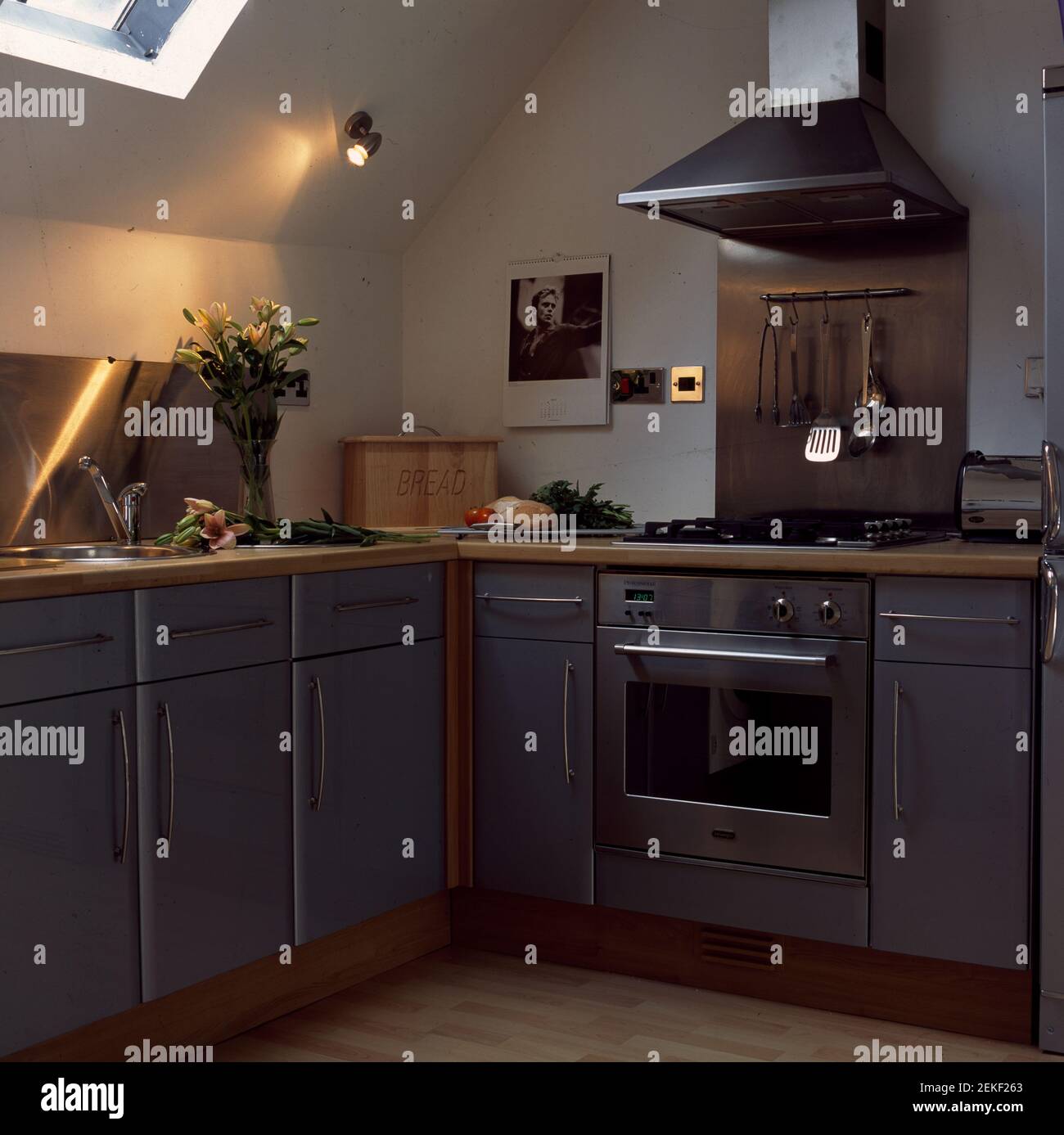 Small black modern attic kitchen Stock Photo - Alamy
