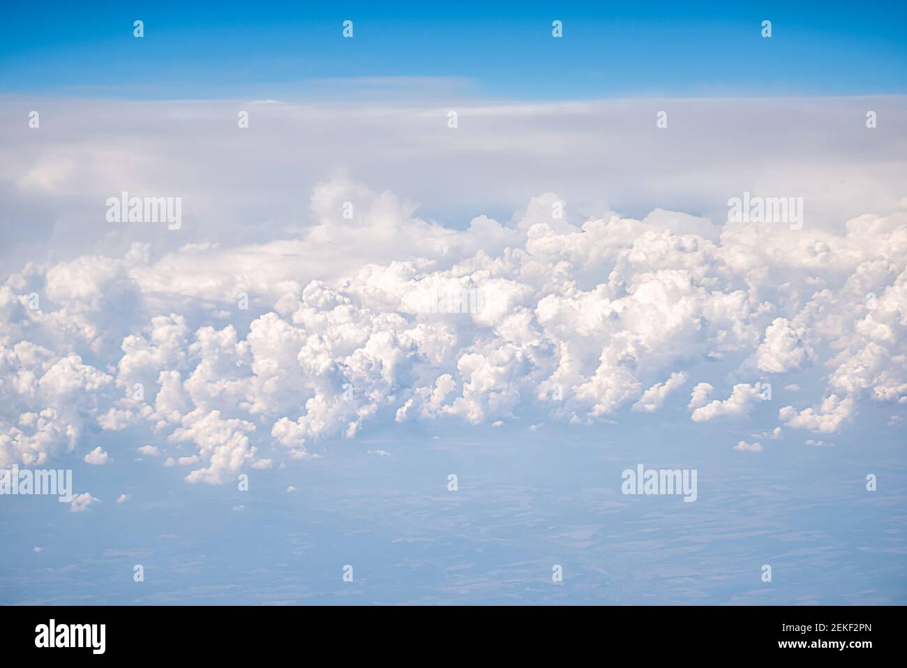 High angle aerial view of sky cloudscape with fluffy clouds and bright ...