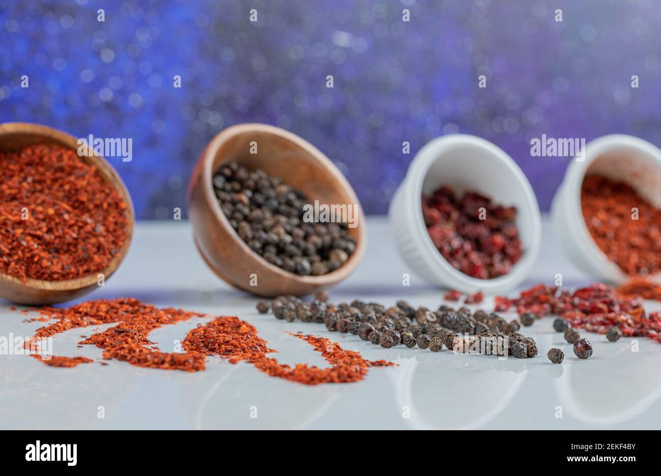 Many bowls of spices on a white background Stock Photo - Alamy