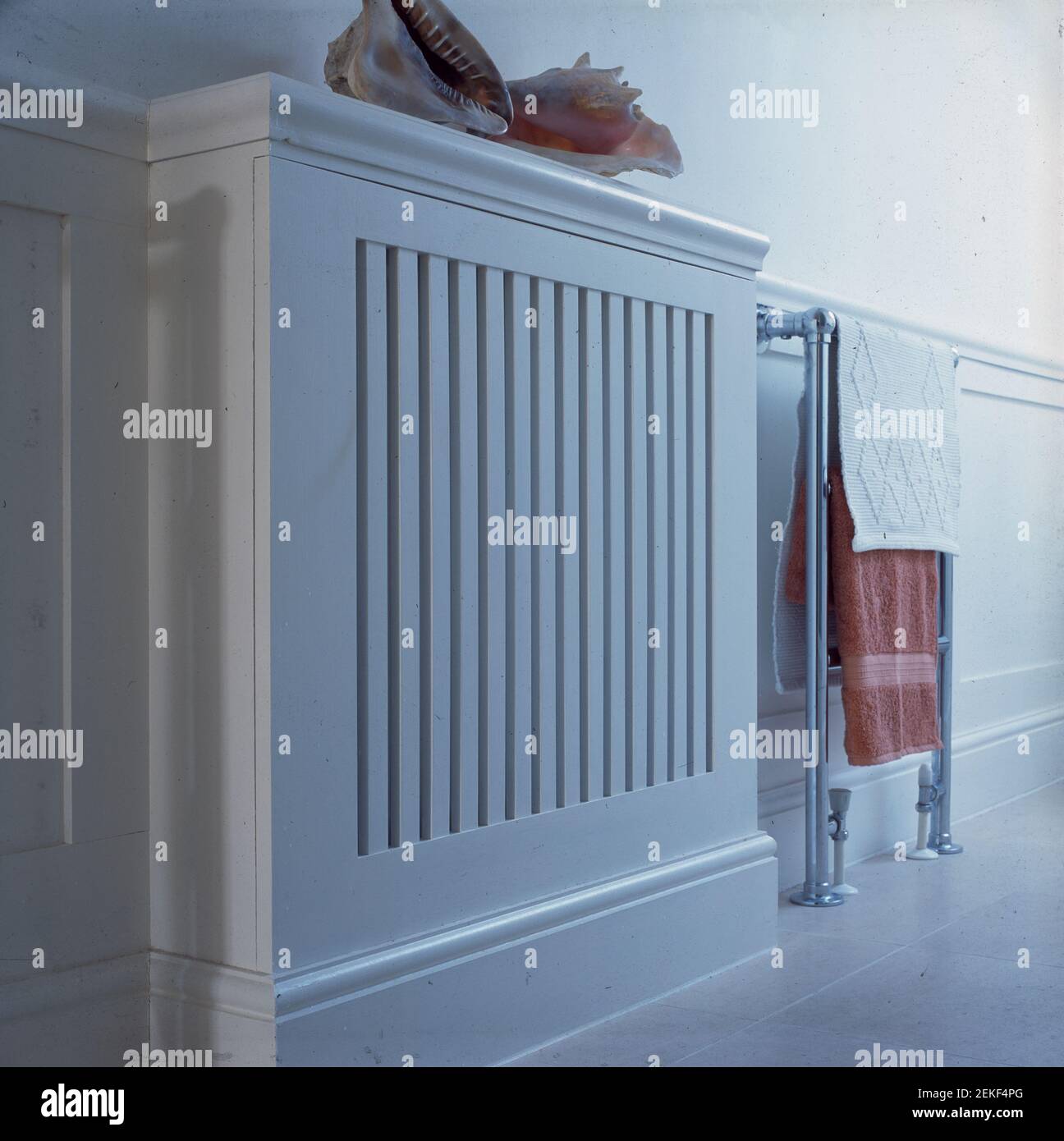 White painted wooden radiator cover in bathroom Stock Photo - Alamy