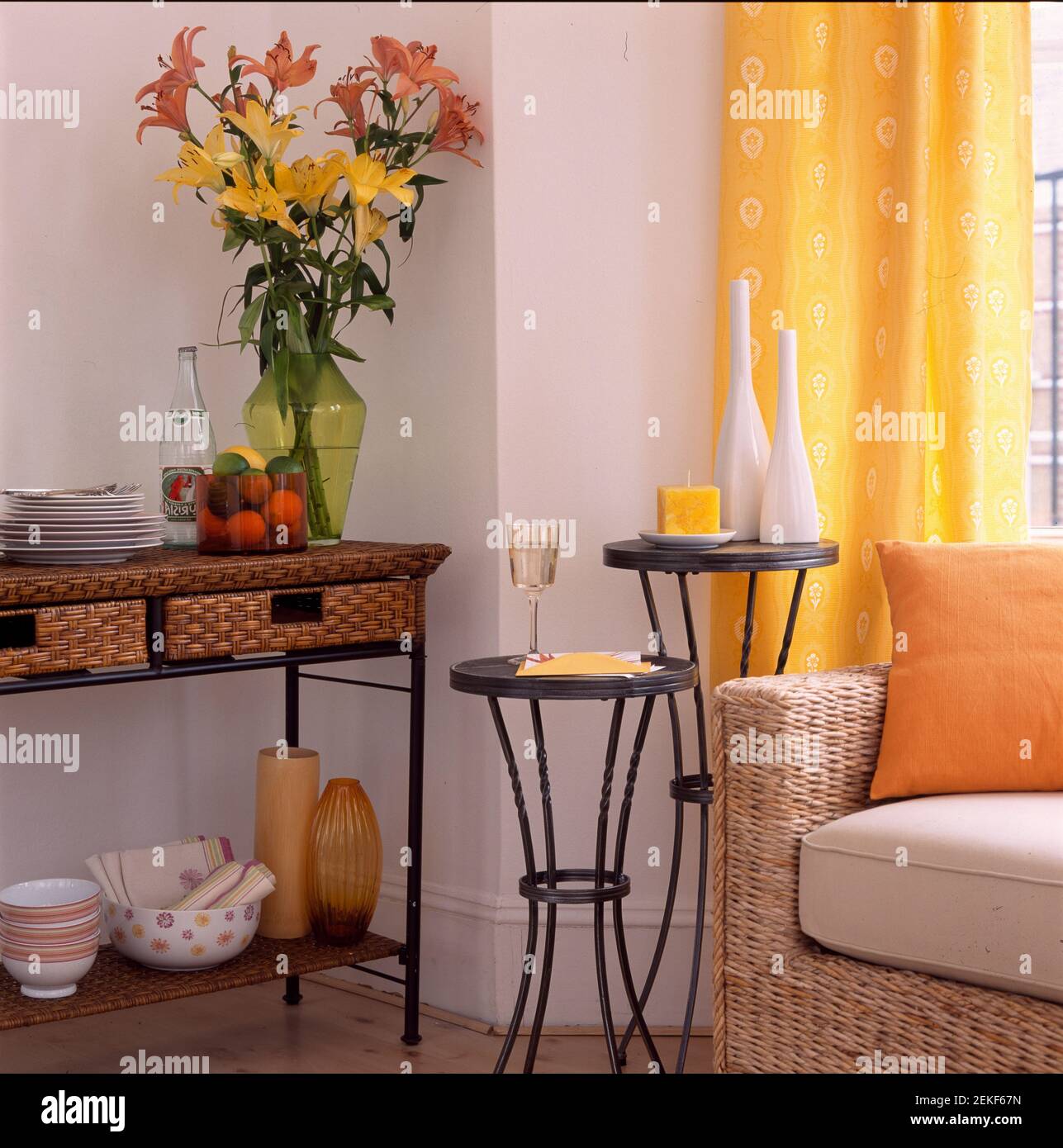 Circular tables in front of wicker sofa and wicket and metal side table ...