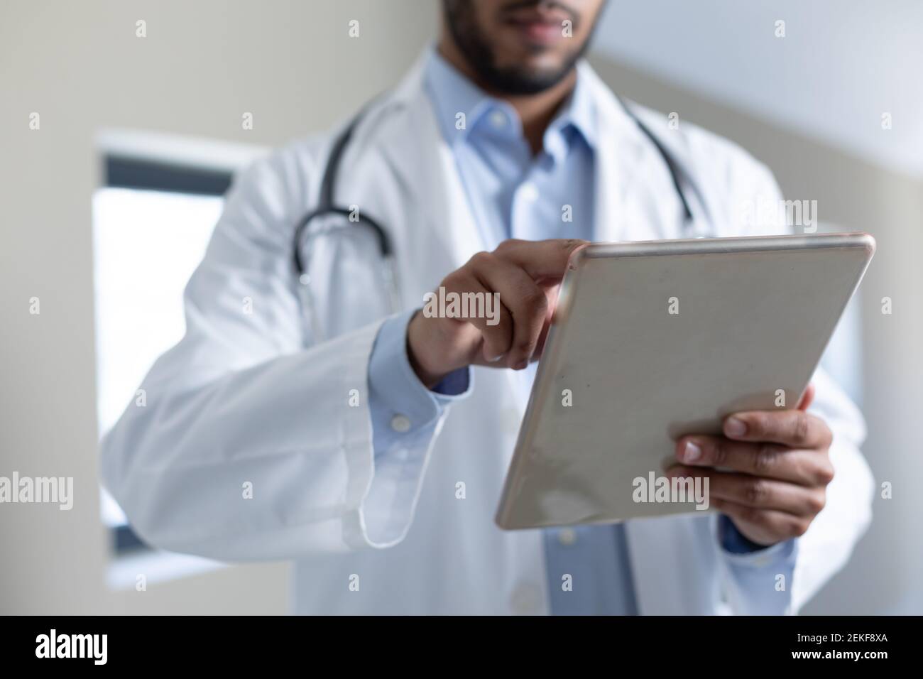 Covid doctor tablet in hi-res stock photography and images - Alamy