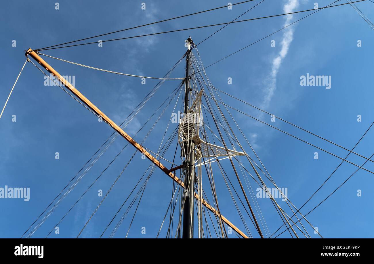 Sailing ship mast against the blue sky on some sailing boats with ...