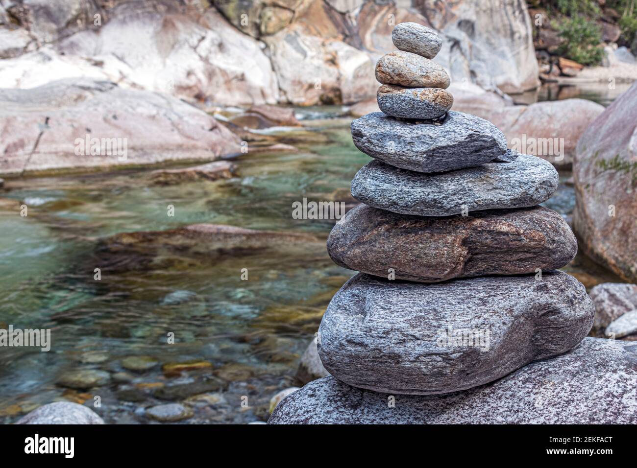 Stack of stones smoothed by flowing river water Stock Photo - Alamy