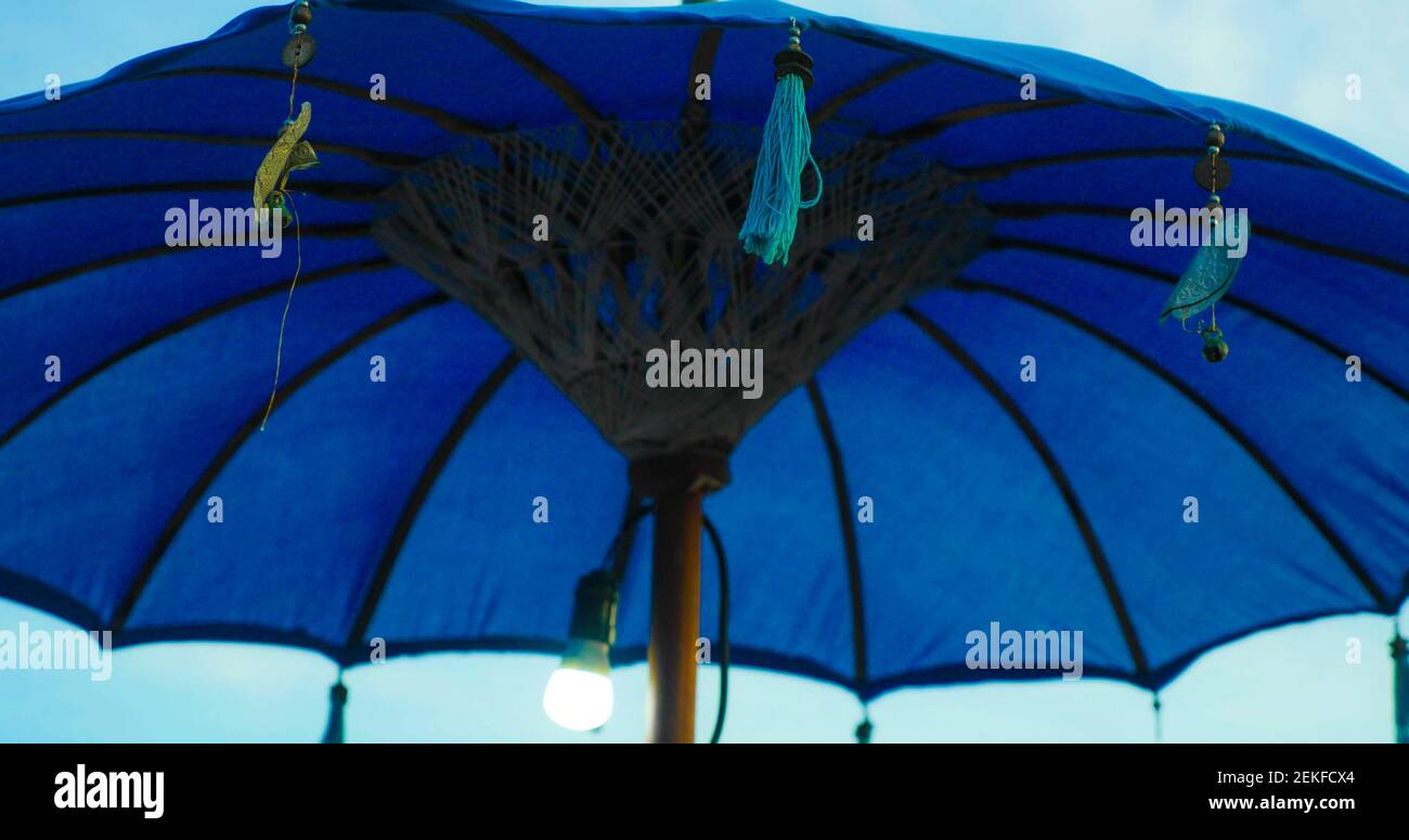 Asian traditional beach sun umbrella in the island of Bali in Indonesia ...