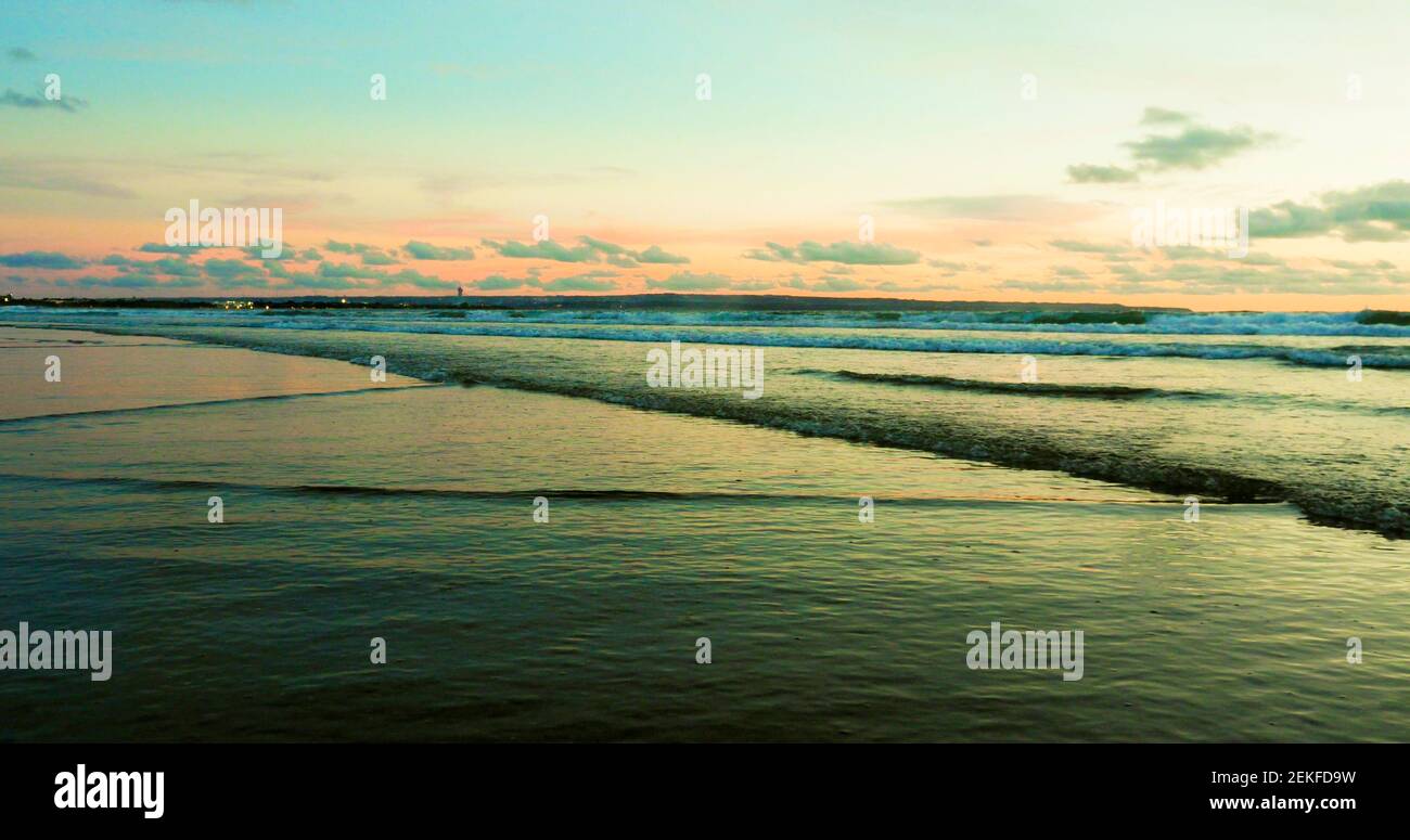 beautiful panoramic view of Asian beach - sunset orange sky over Bali ...