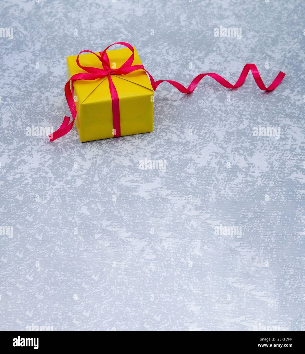 yellow gift box with red ribbon, , gray background, yellow box color ...