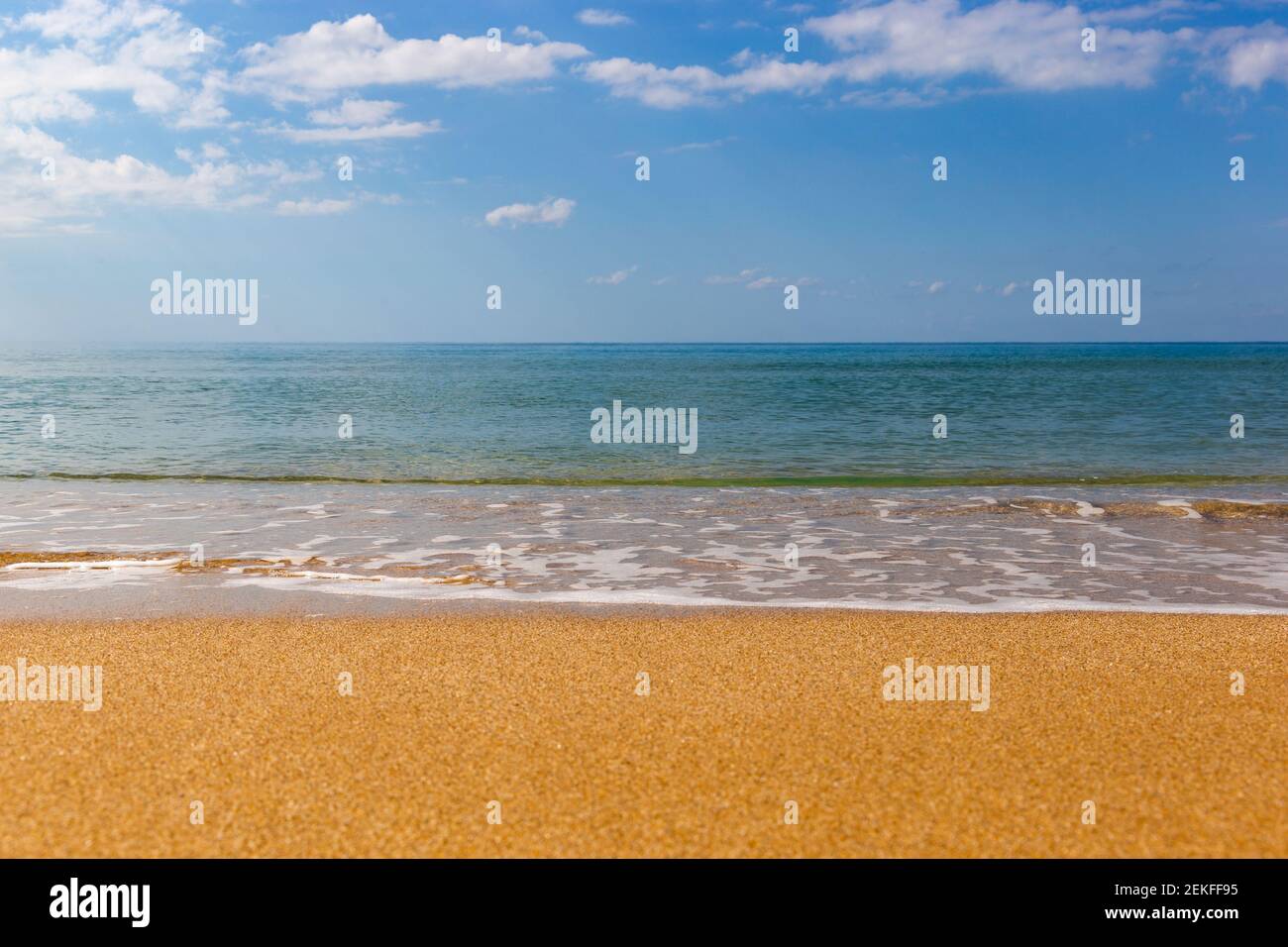 Sea beach with sand and waves. Sunny day Stock Photo - Alamy