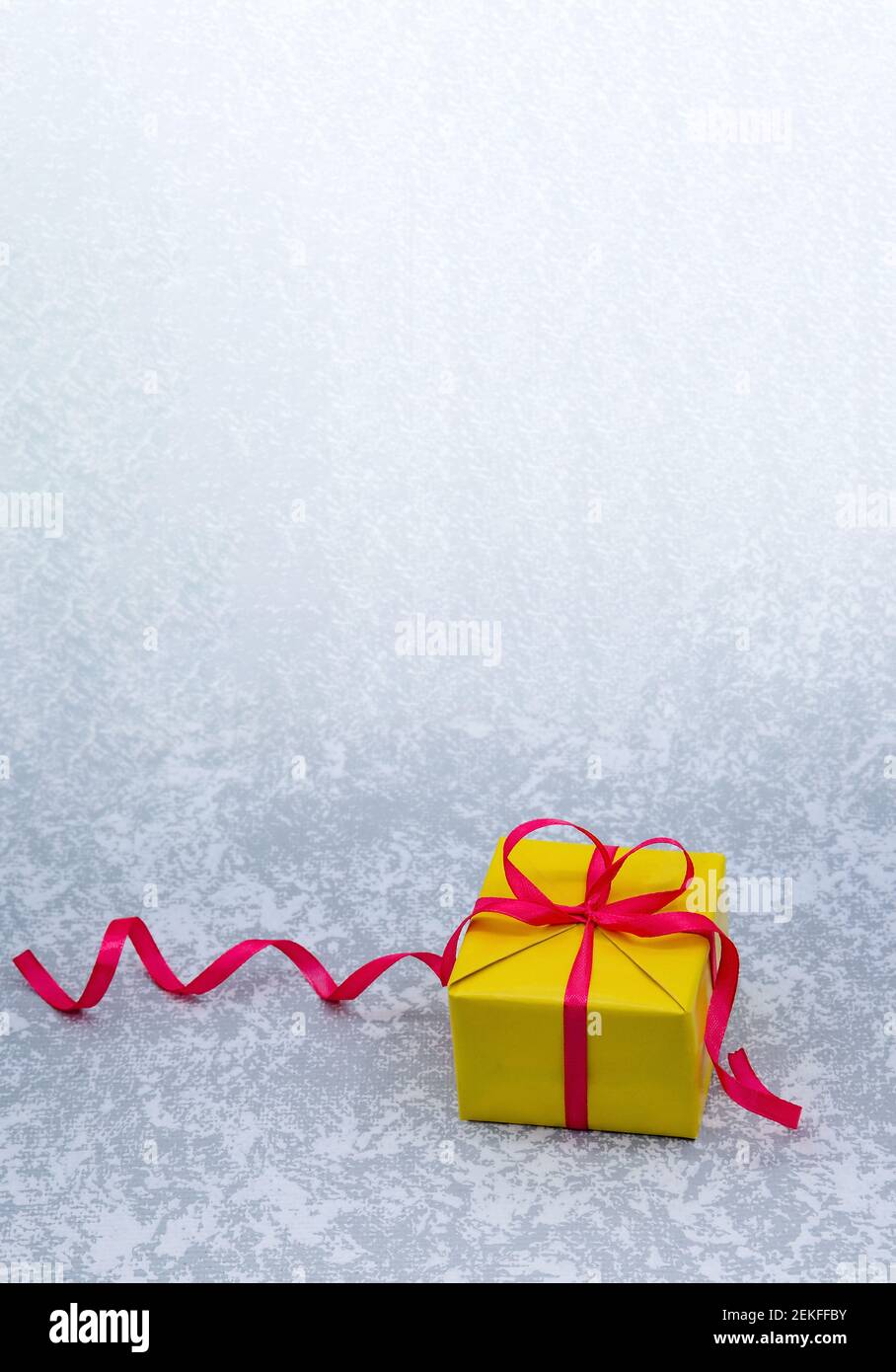 yellow gift box with red ribbon, , gray background, yellow box color ...