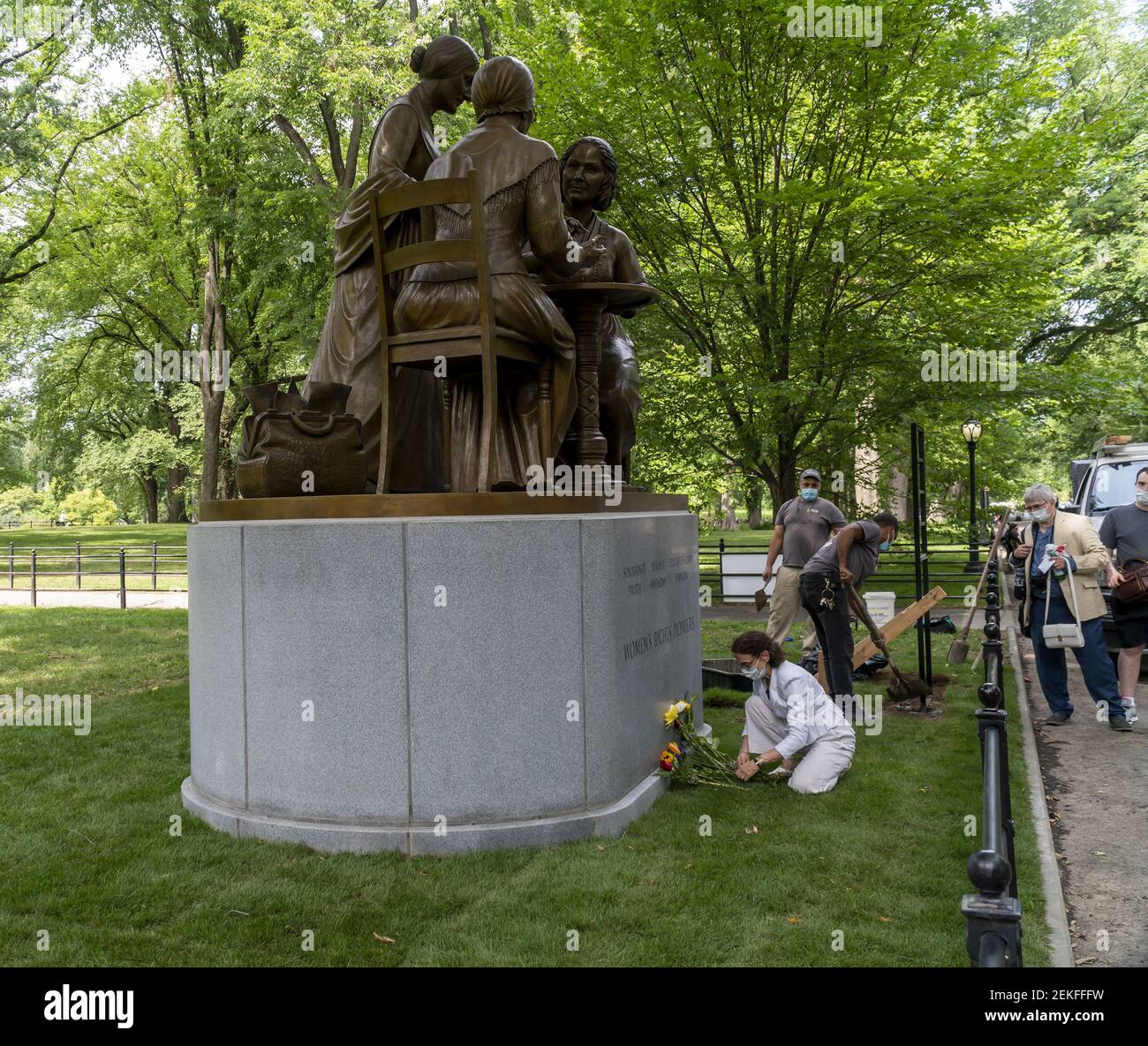 The artist Meredith Bergmann arranges flowers in front of her Womenâ€™s ...