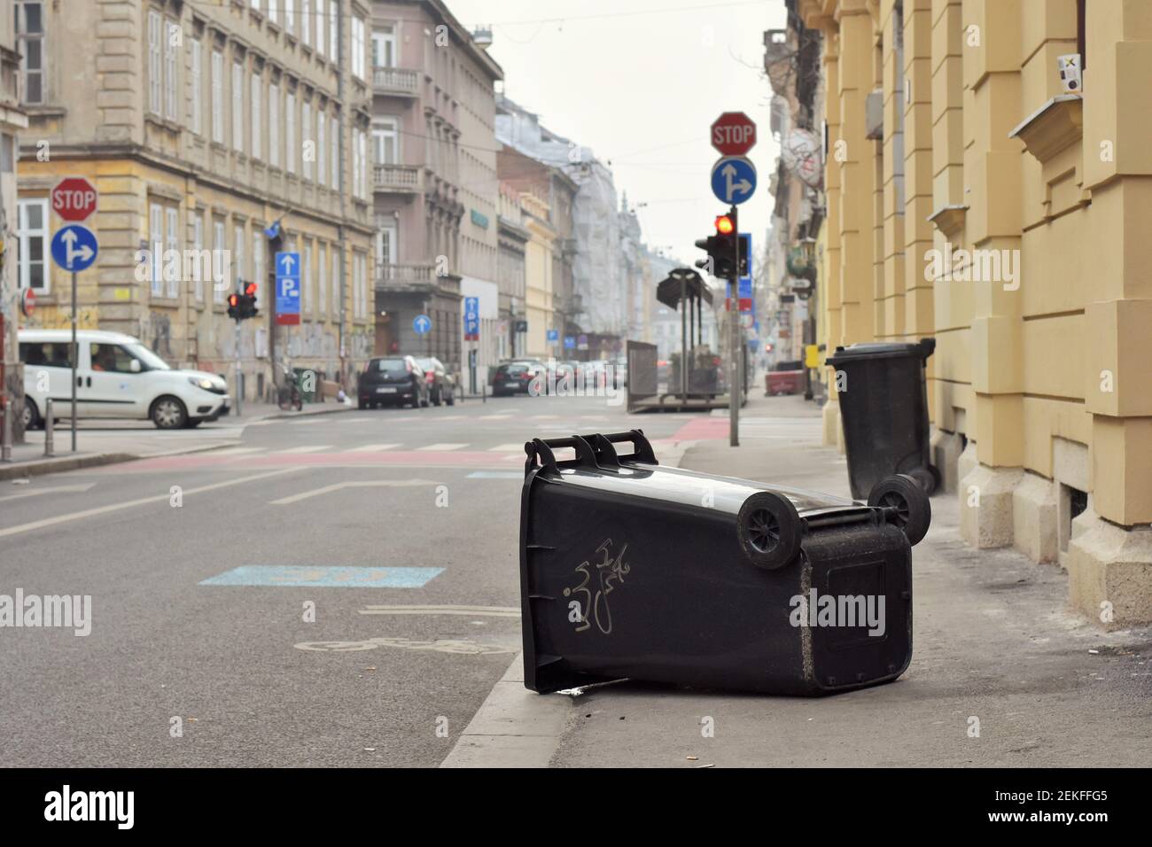 Fallen trash can Stock Photo - Alamy
