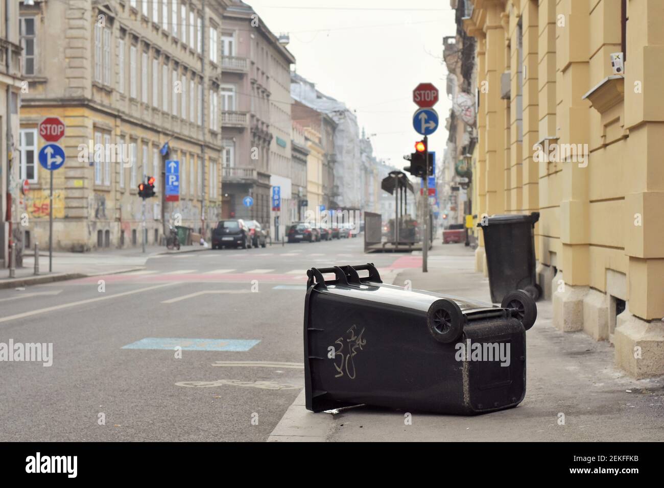 Fallen trash can Stock Photo - Alamy