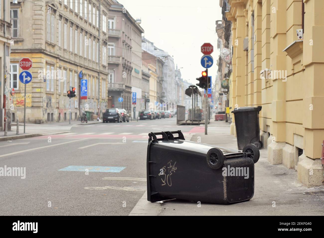 Fallen trash can Stock Photo - Alamy