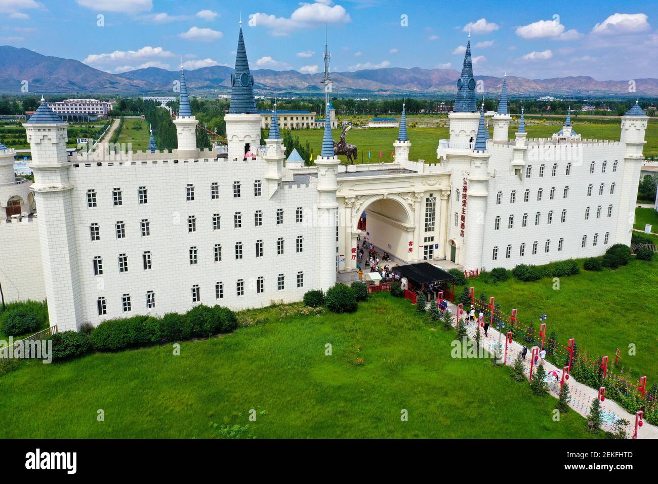 Aerial view of a European style castle by Lake Dai in Ulanqab city ...