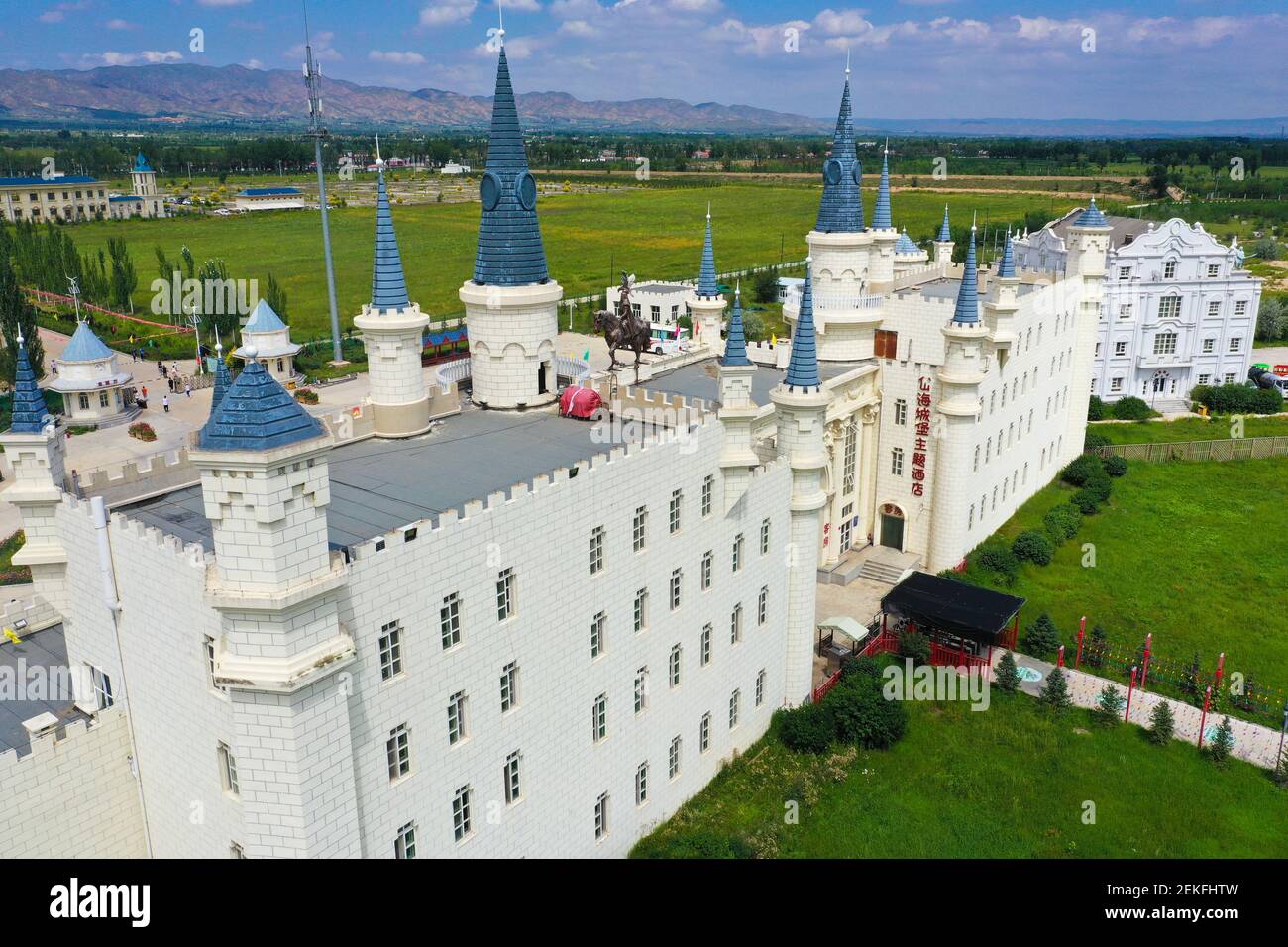 Aerial view of a European style castle by Lake Dai in Ulanqab city ...