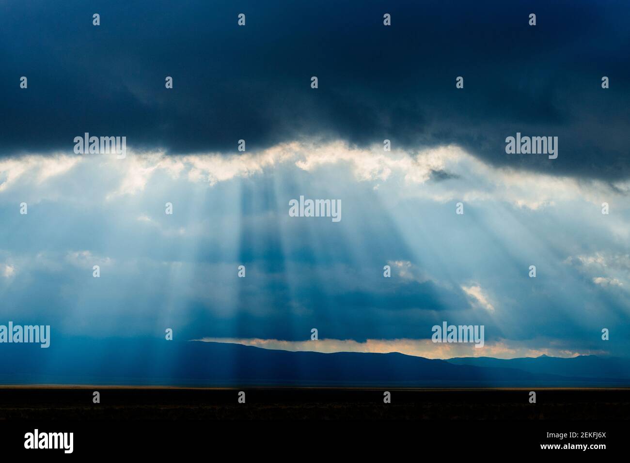 Rays of sun shining through storm clouds, Great Basin National Park ...