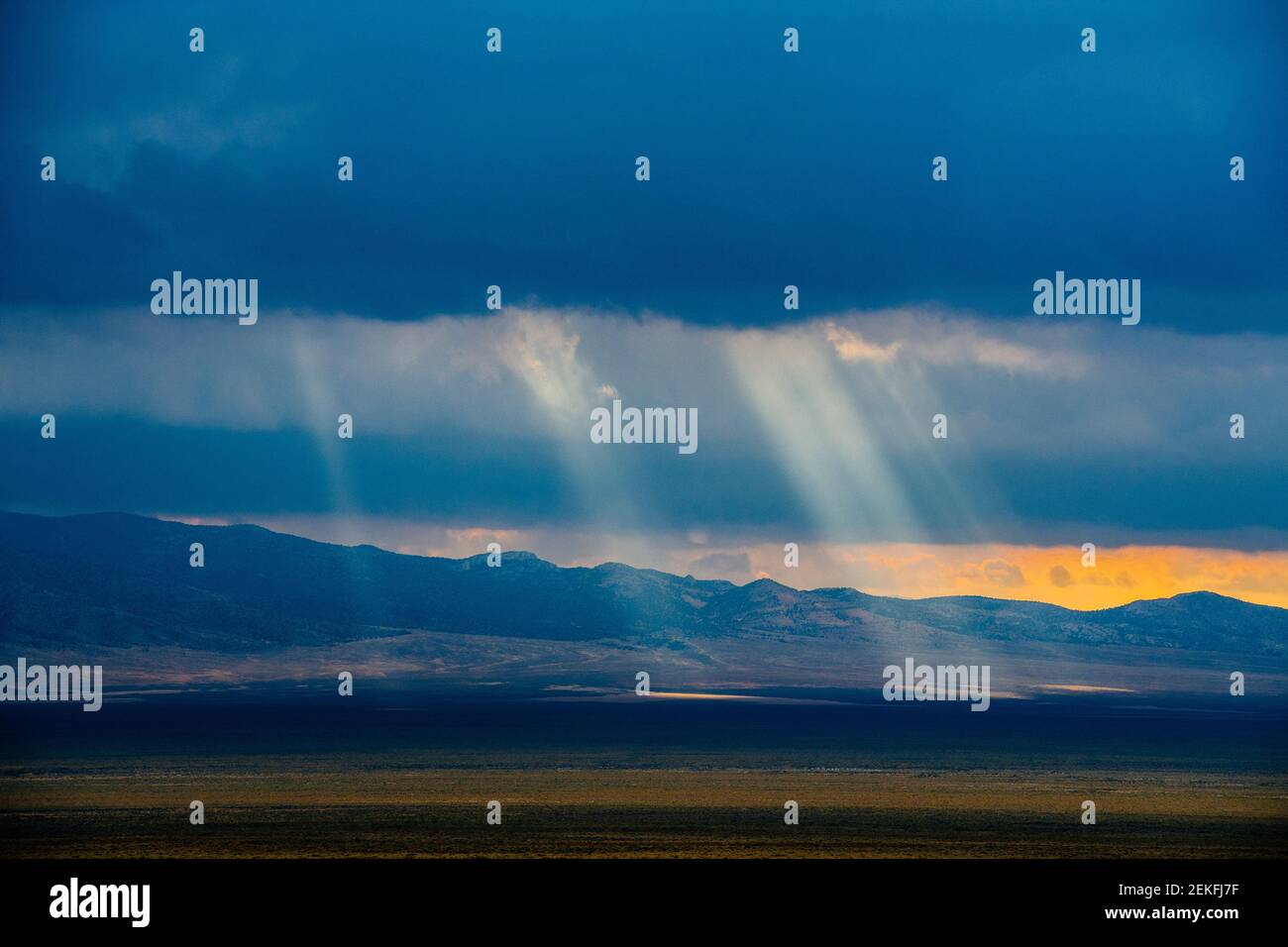 Rays of sun shining through storm clouds, Great Basin National Park ...