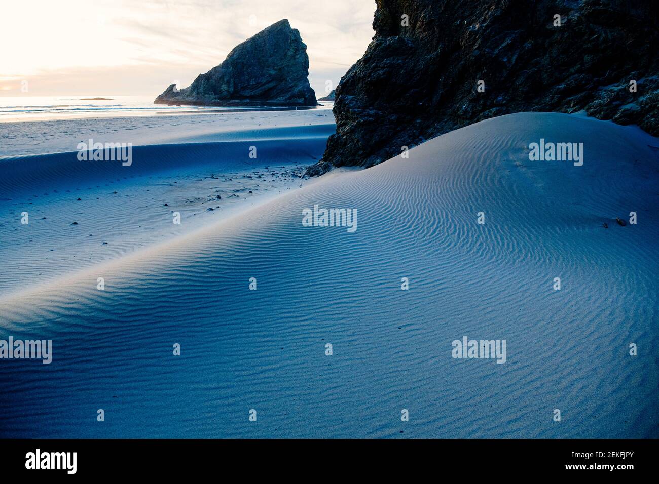 Rock formations on sandy beach at sunrise, Myers Creek Beach, Gold ...
