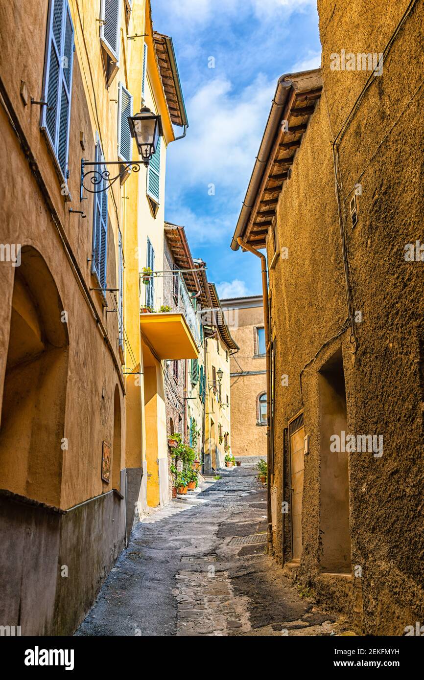 Chiusi, Italy dark narrow street alley in small historic medieval town ...