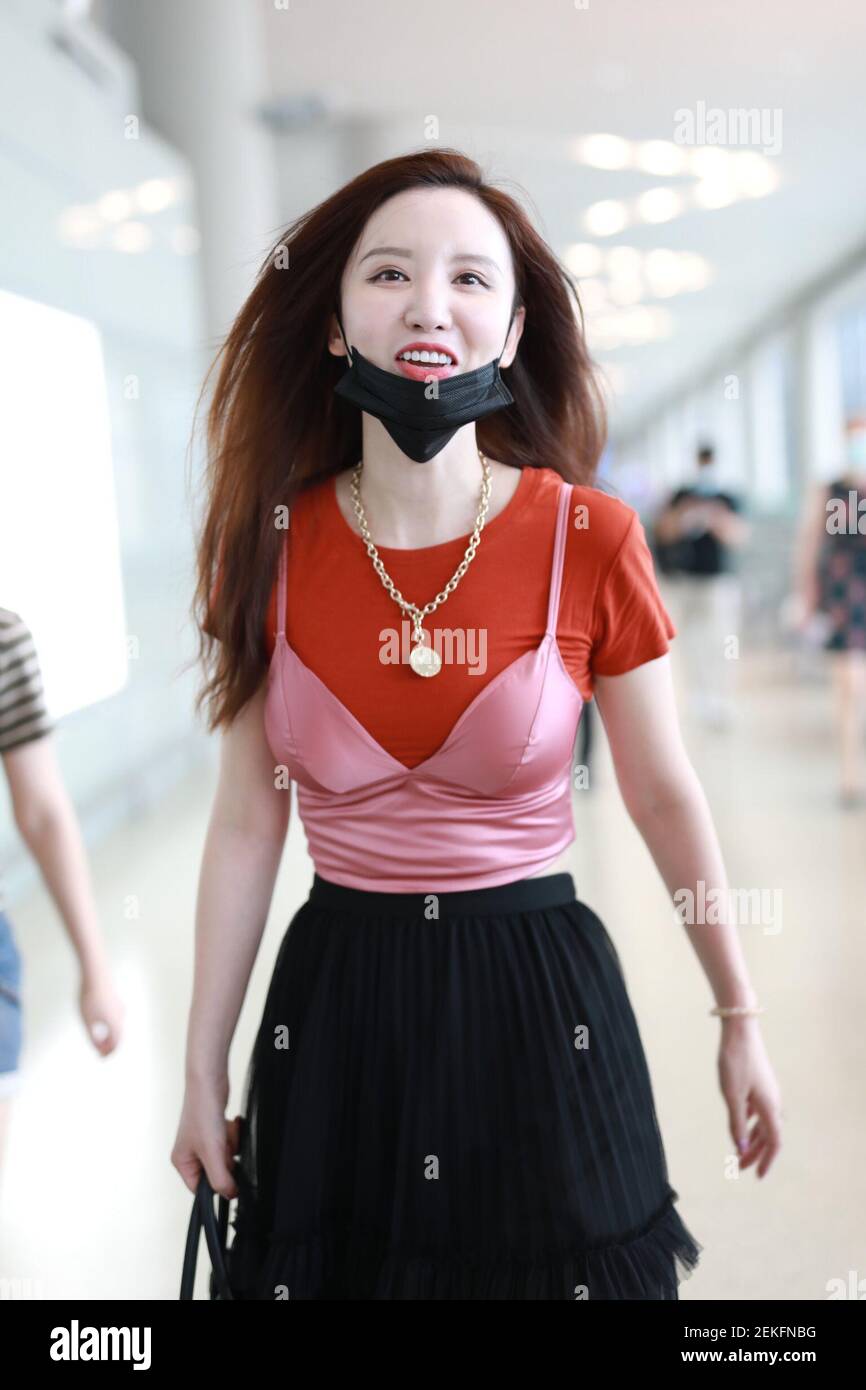Chinese actress and producer Alina Zhang arrives at a Beijing airport ...