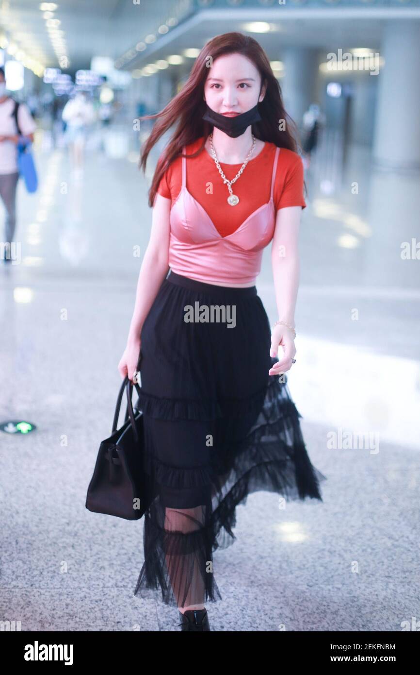 Chinese actress and producer Alina Zhang arrives at a Beijing airport ...