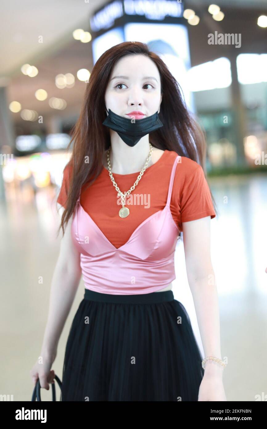 Chinese actress and producer Alina Zhang arrives at a Beijing airport ...