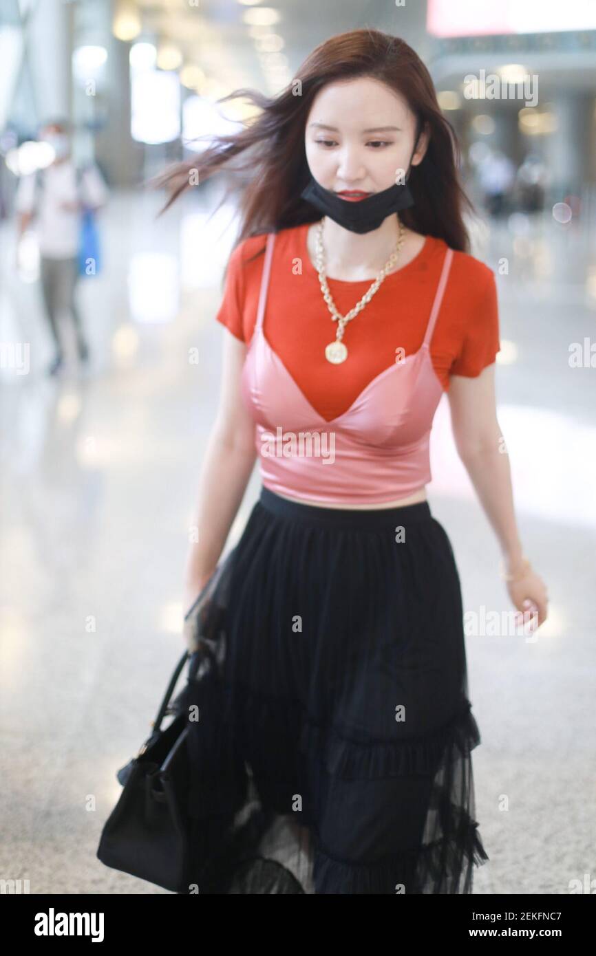Chinese actress and producer Alina Zhang arrives at a Beijing airport ...