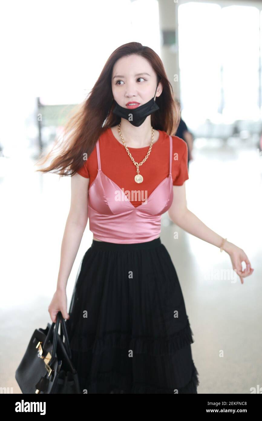 Chinese actress and producer Alina Zhang arrives at a Beijing airport ...