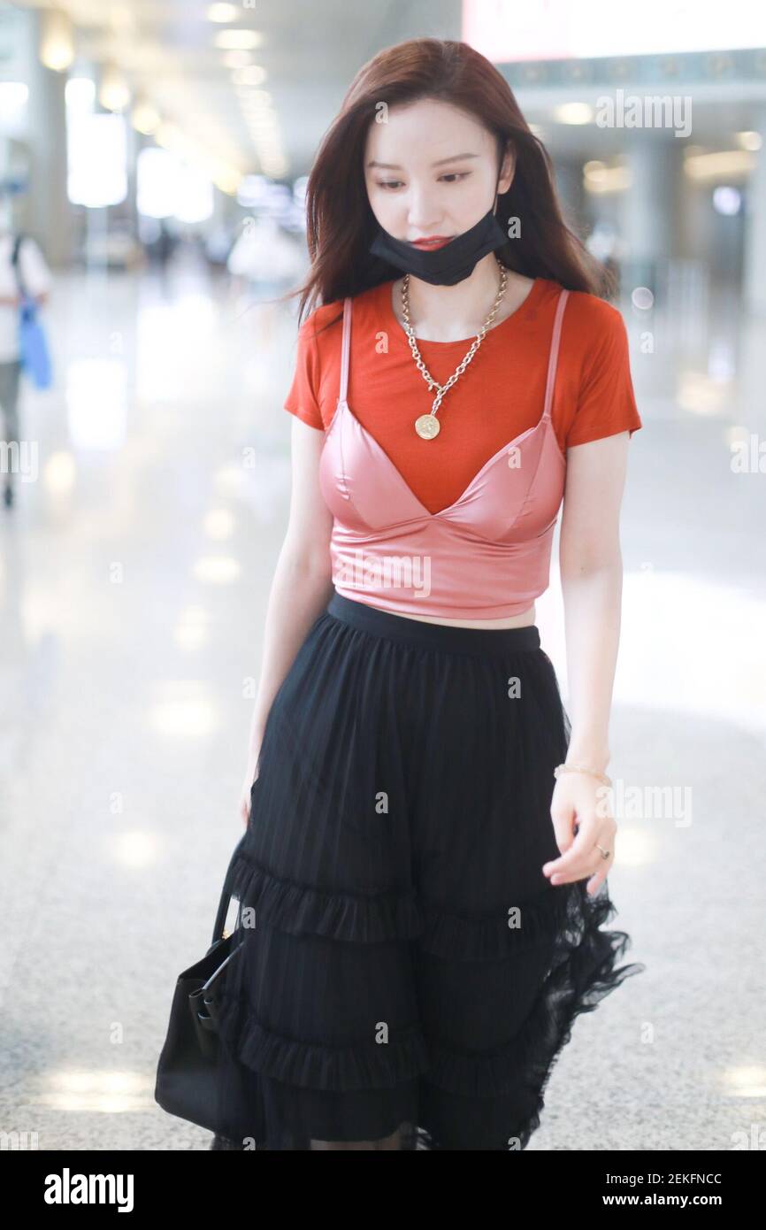 Chinese actress and producer Alina Zhang arrives at a Beijing airport ...