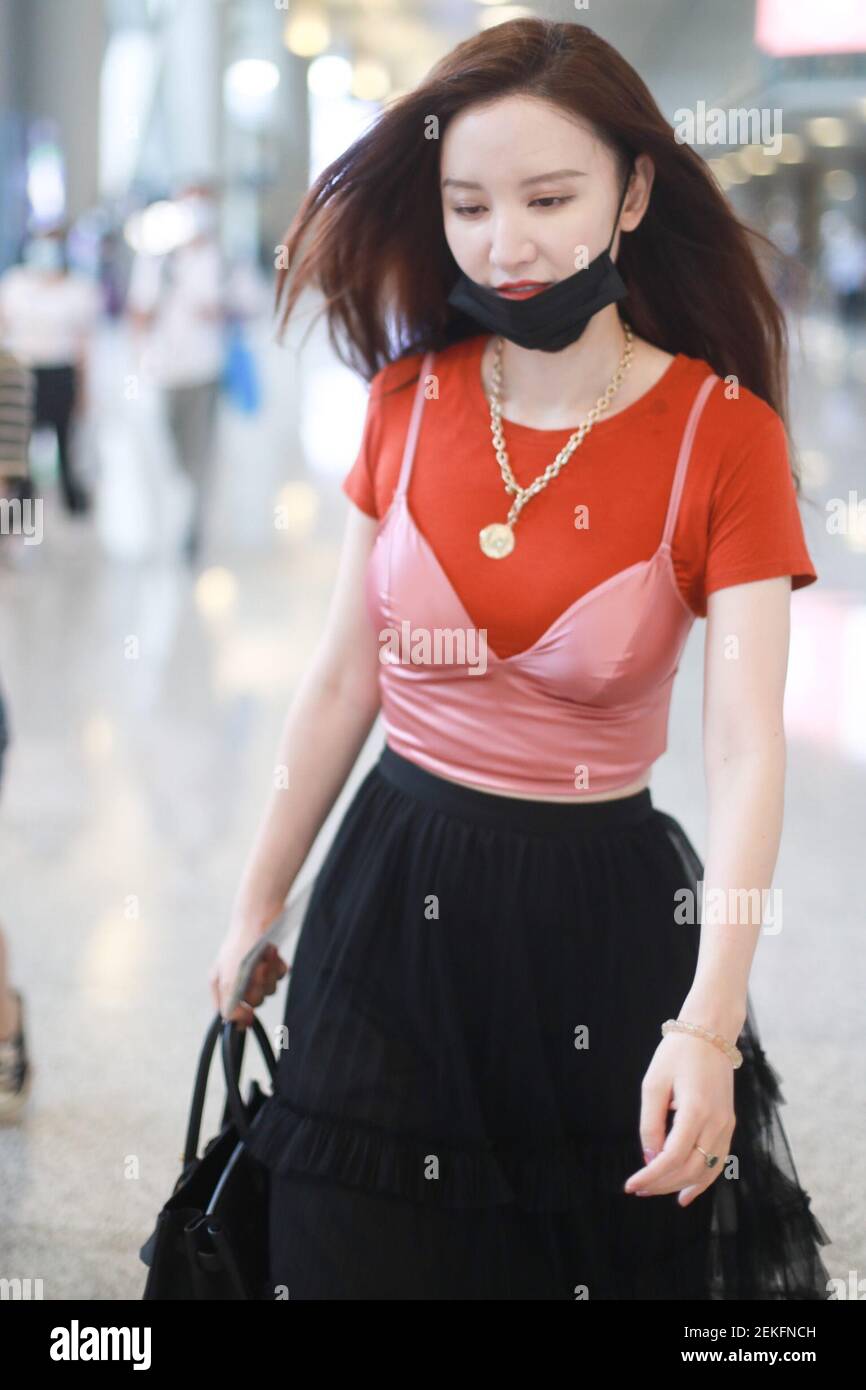 Chinese actress and producer Alina Zhang arrives at a Beijing airport ...