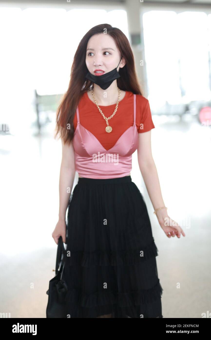 Chinese actress and producer Alina Zhang arrives at a Beijing airport ...