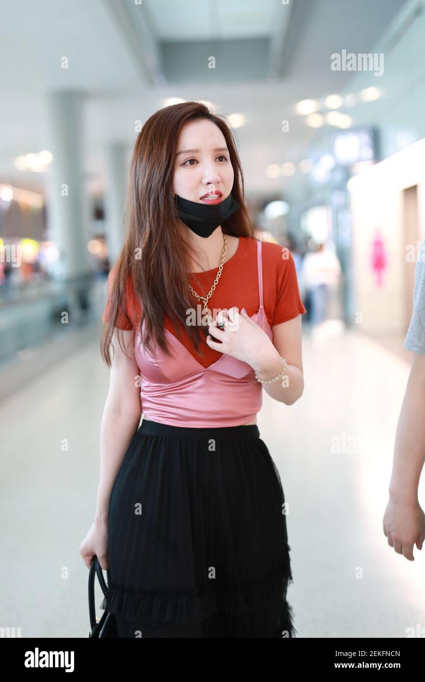Chinese actress and producer Alina Zhang arrives at a Beijing airport ...