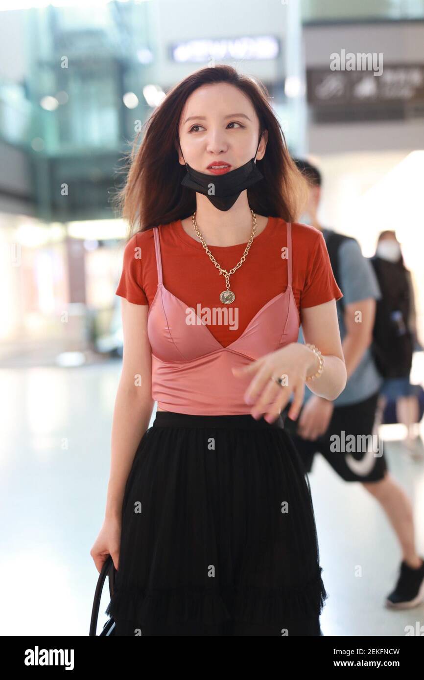Chinese actress and producer Alina Zhang arrives at a Beijing airport ...