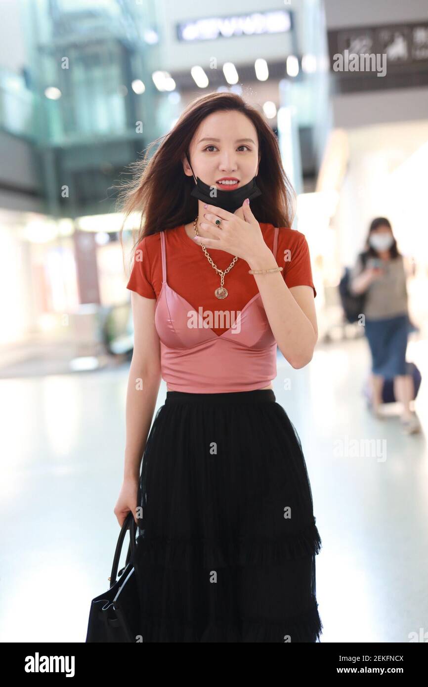 Chinese actress and producer Alina Zhang arrives at a Beijing airport ...
