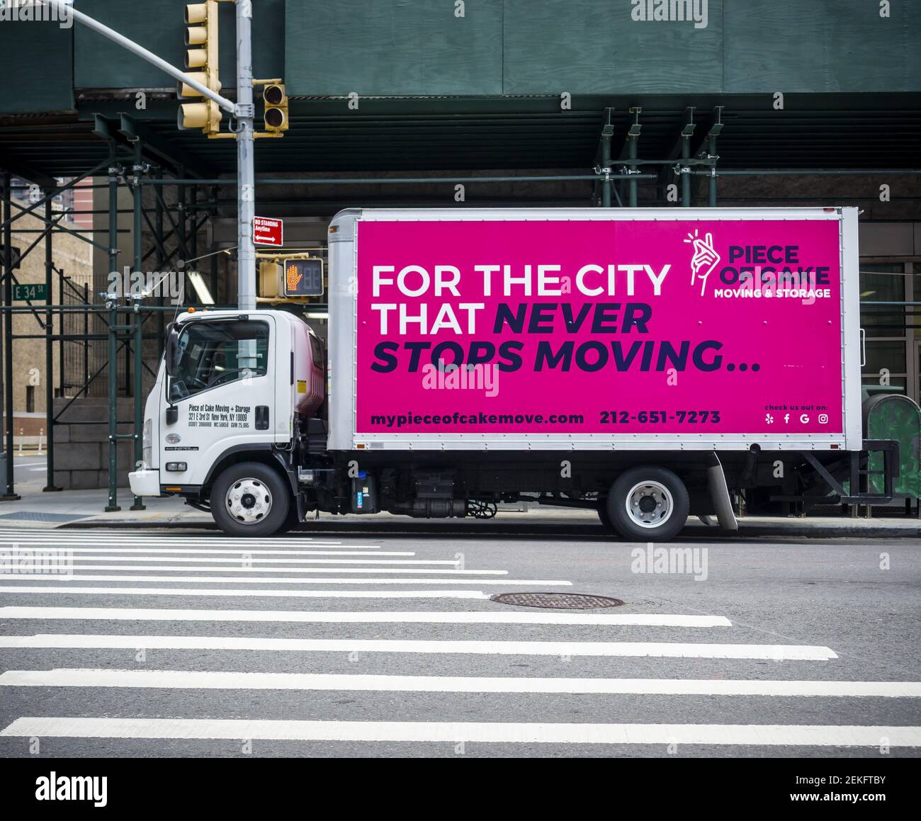 Worker loads up a moving van in the Kips Bay neighborhood in New York ...