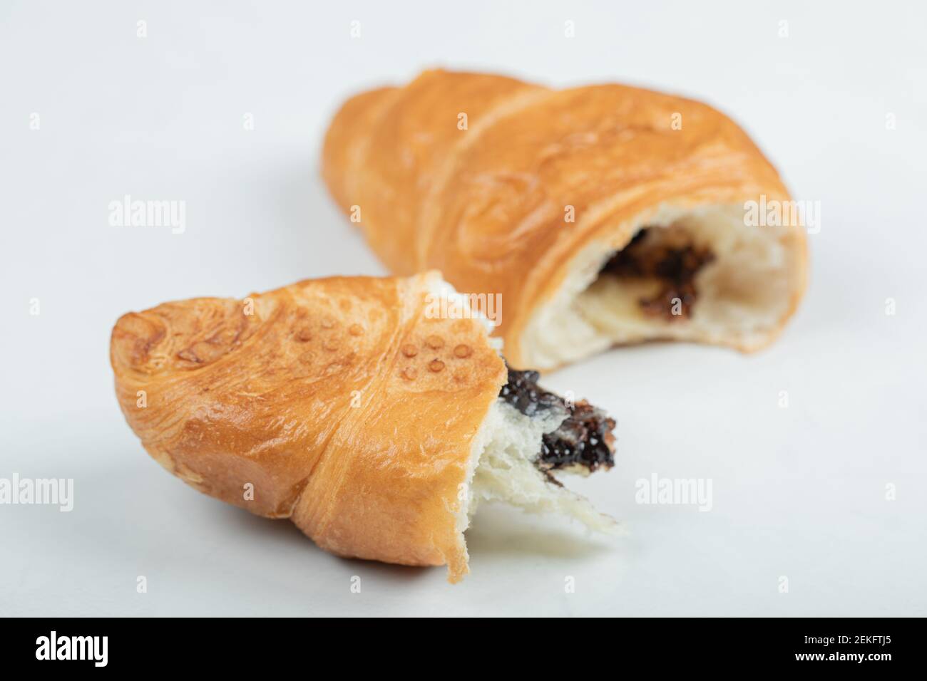 Croissant with chocolate filling on a white background Stock Photo - Alamy