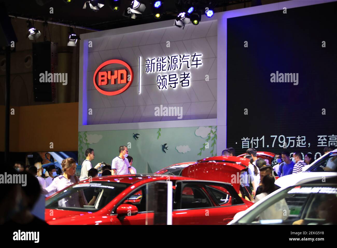 Visitors flock to the booth of BYD Auto, the automotive subsidiary of ...