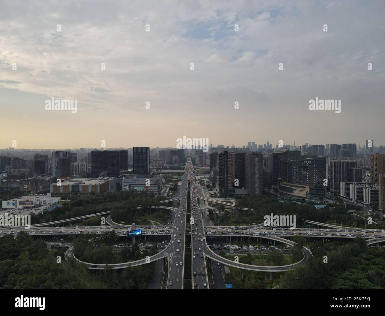 An aerial view of vehicles move fluently on the traffic flow which ...