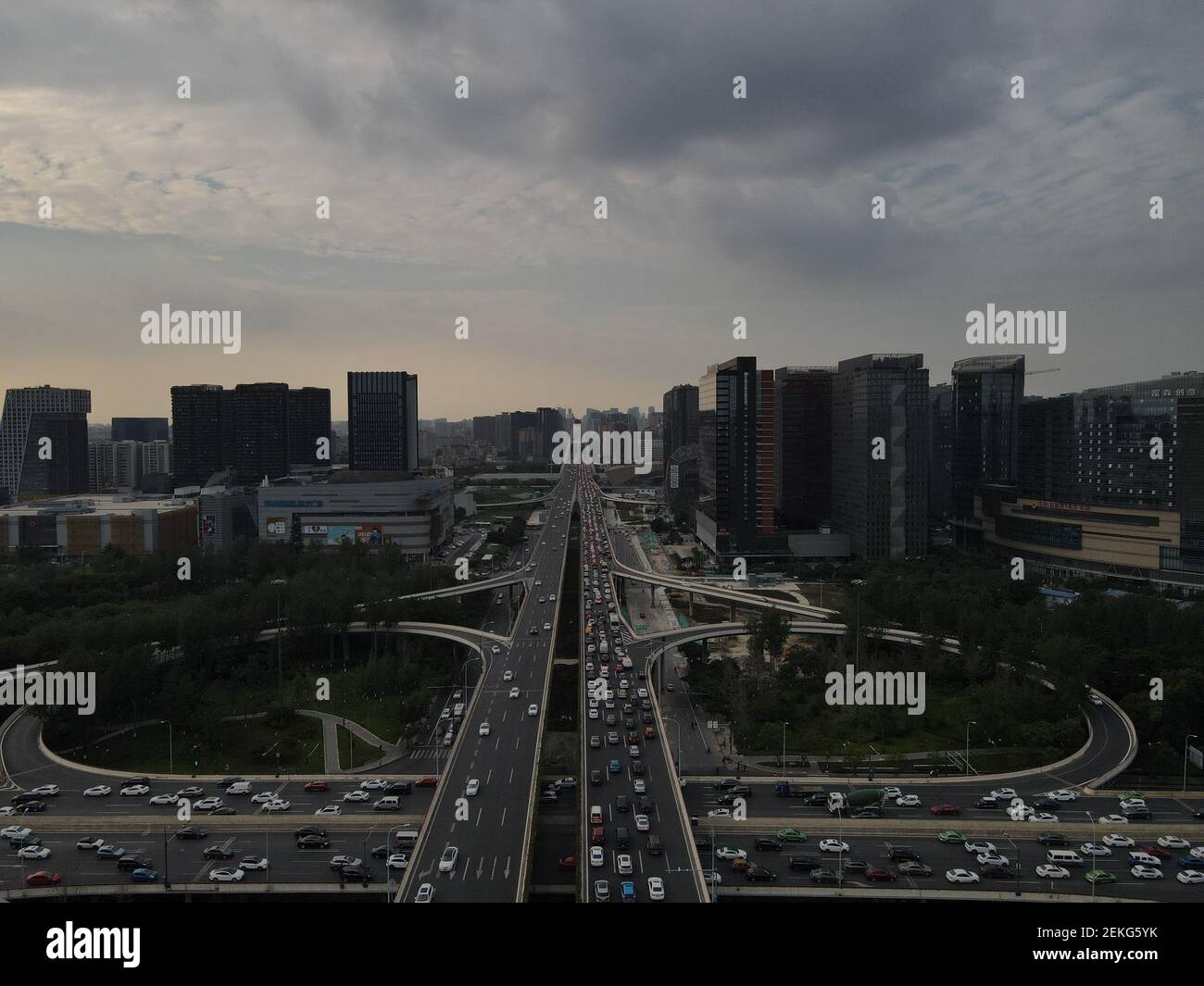 An aerial view of vehicles move fluently on the traffic flow which ...