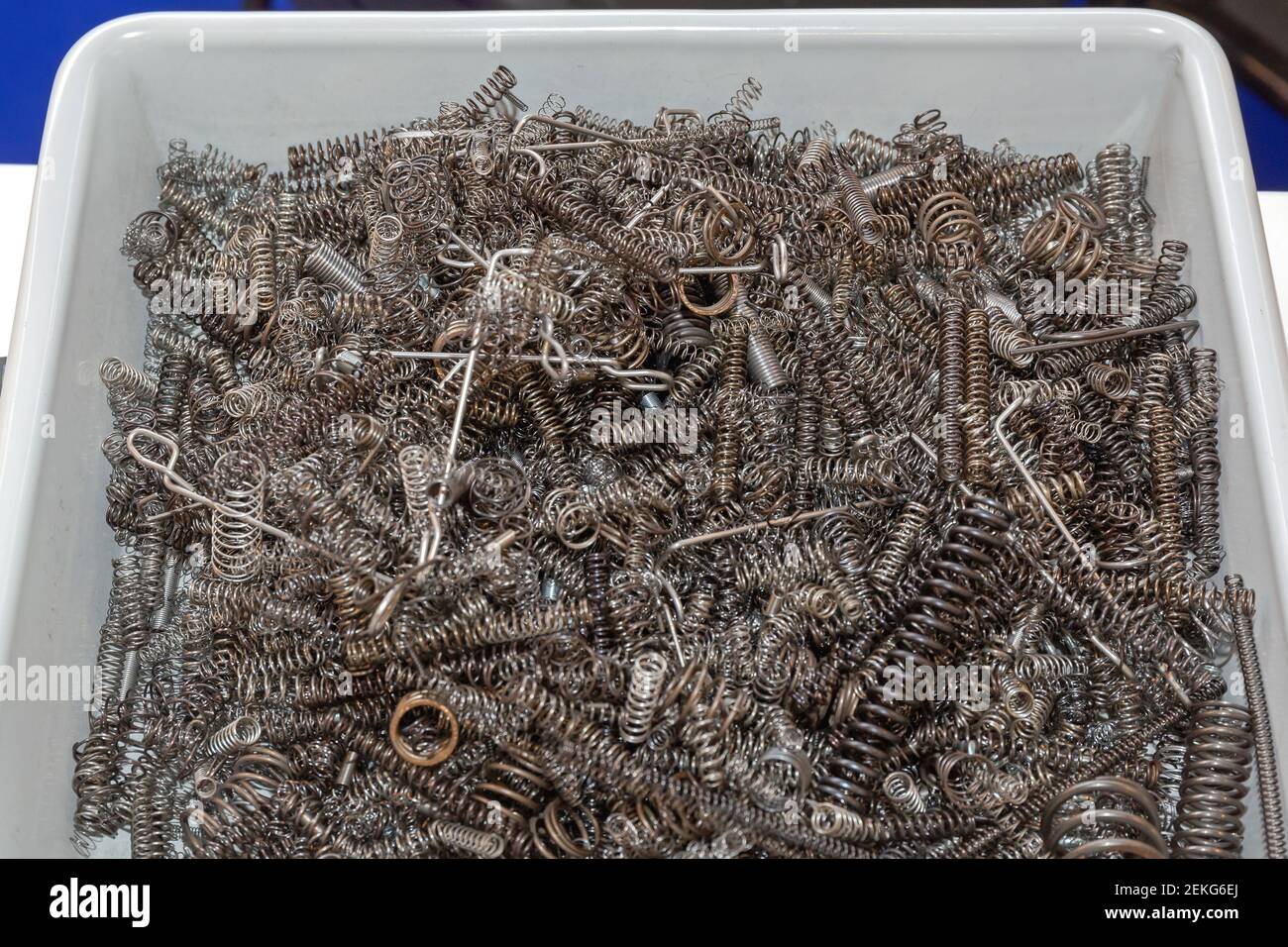 Many Metal Spring Coils Parts in Crate Stock Photo - Alamy