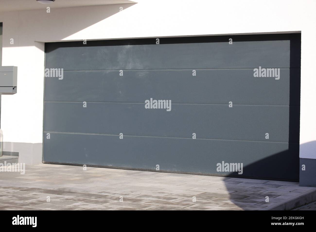 Modern new garage door (sectional door Stock Photo - Alamy