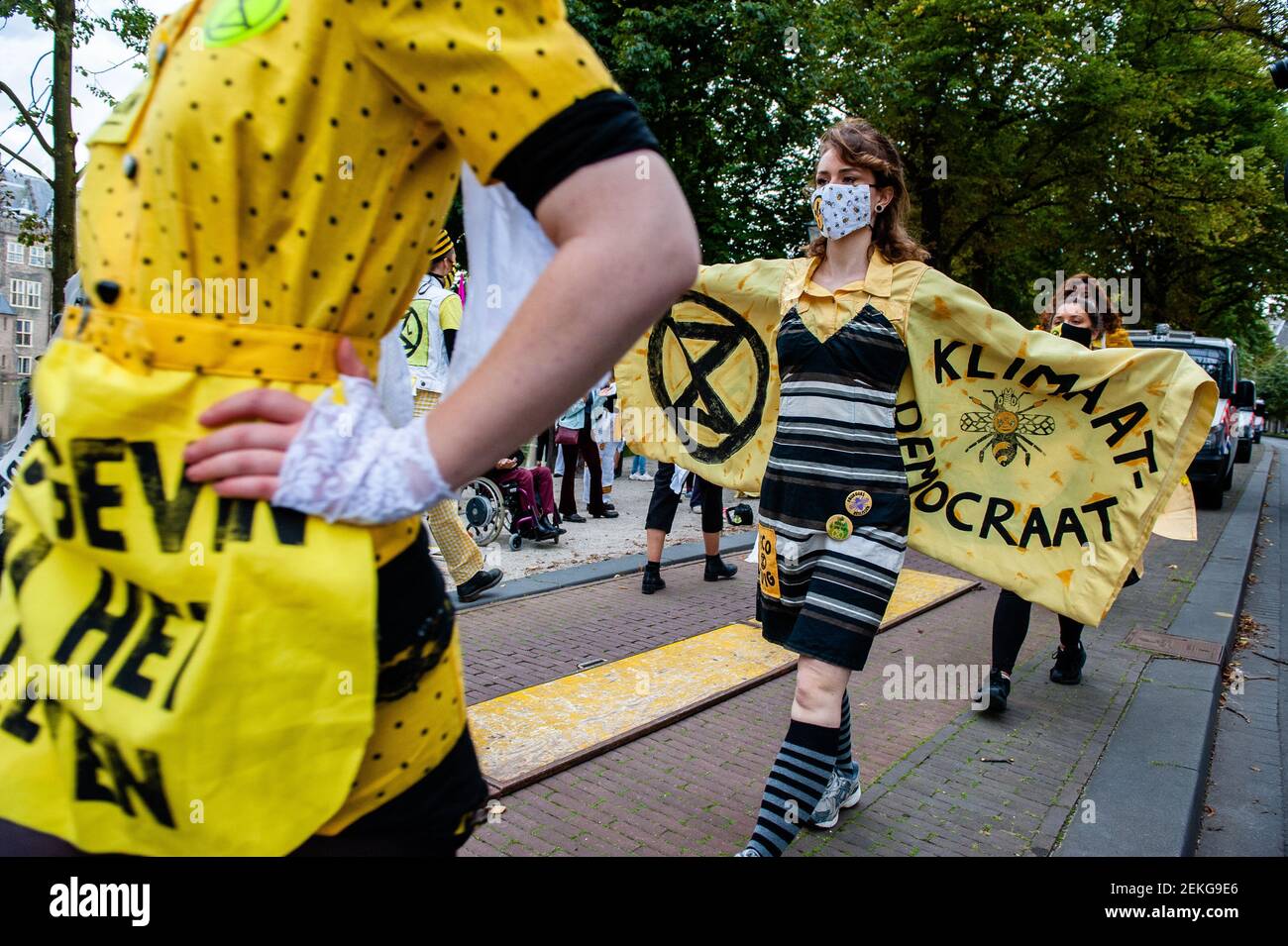 A model showing her dress with a climate message during the fashion ...