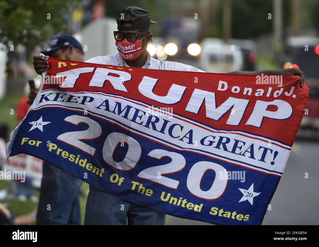 A man holds a Trump flag during the rally. Vice President Mike Pence ...