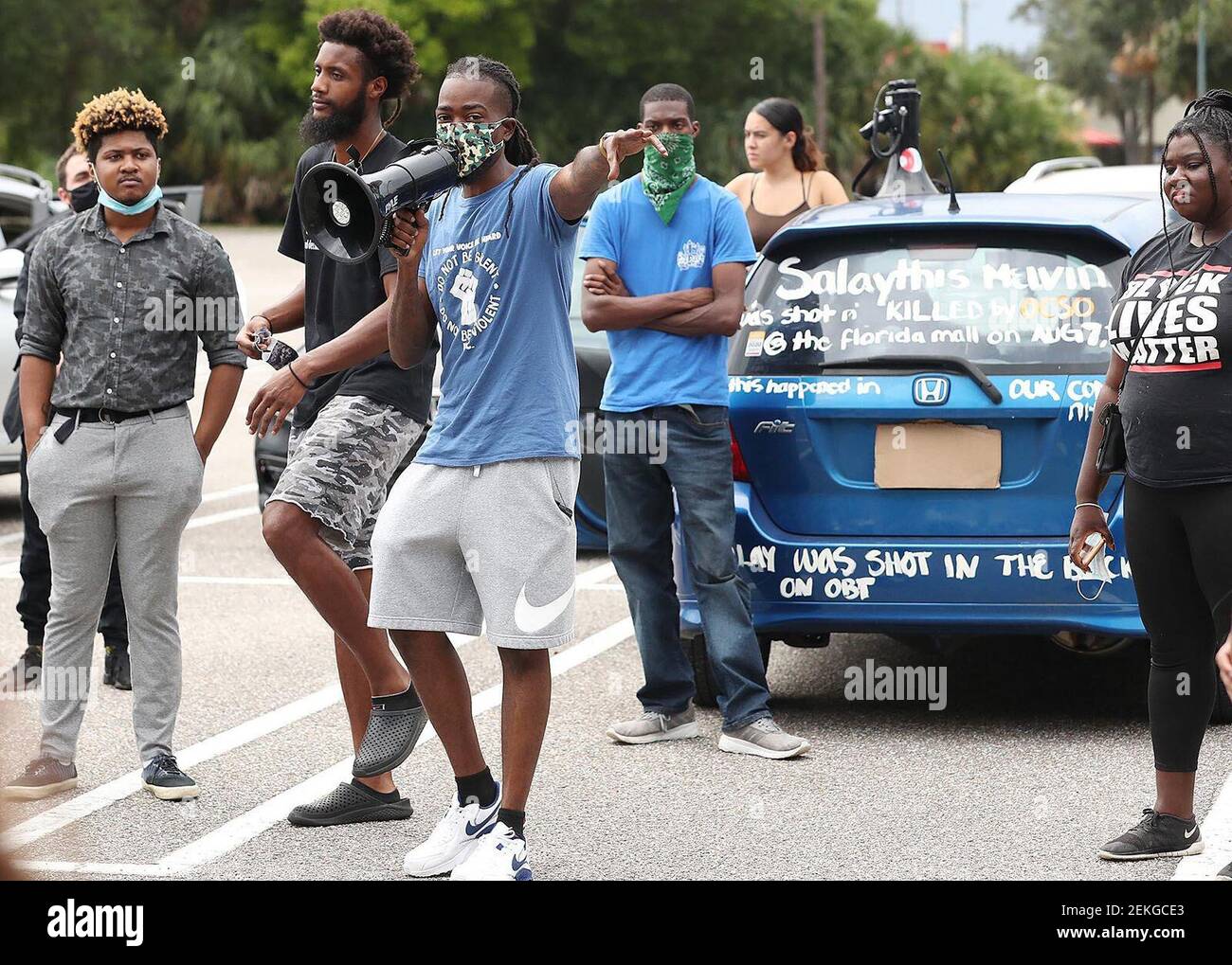 Protesters gather at the Florida Mall in Orlando, Florida on Friday ...