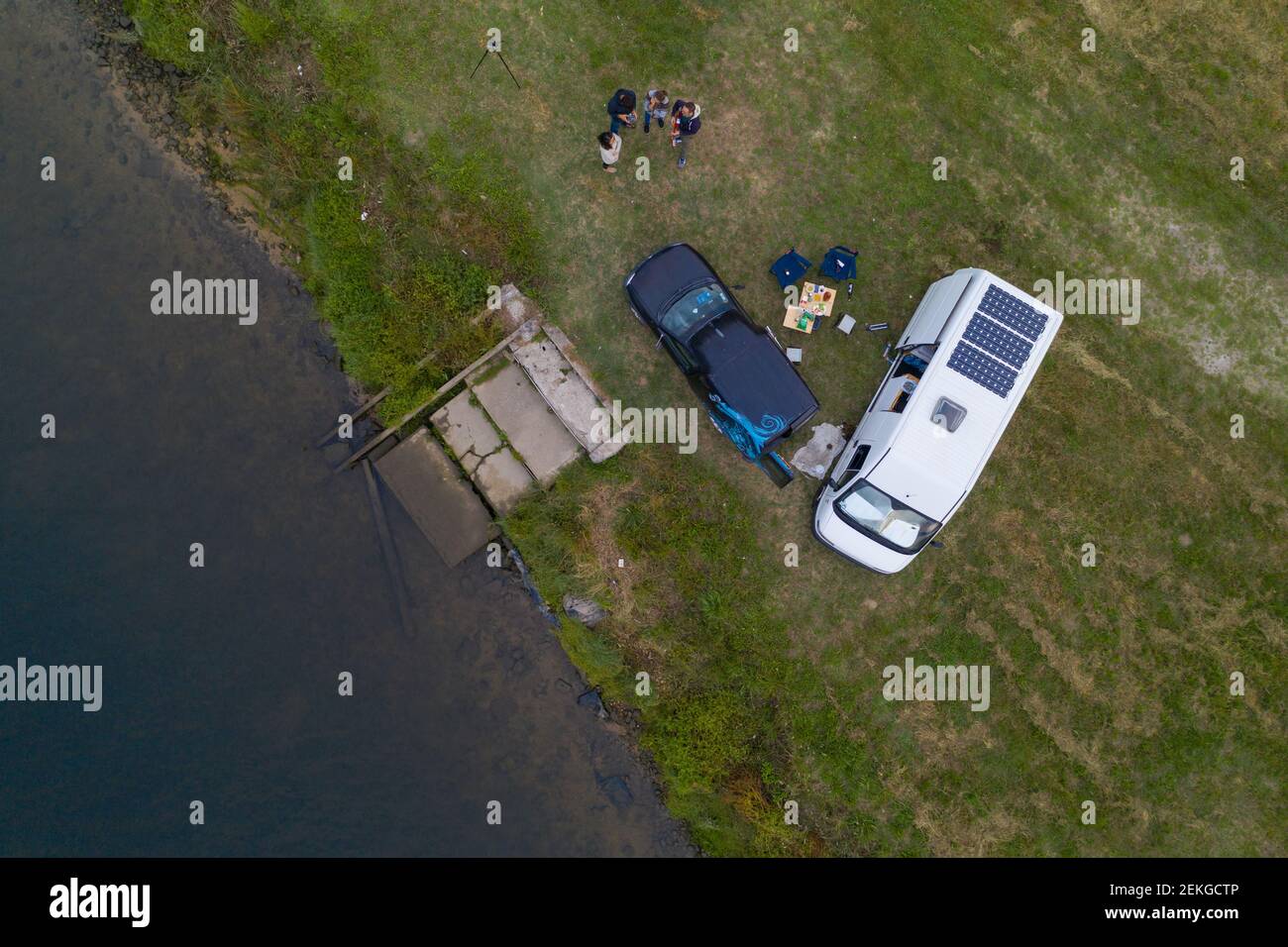 Camper van motorhome with solar panels drone aerial view of two couples ...