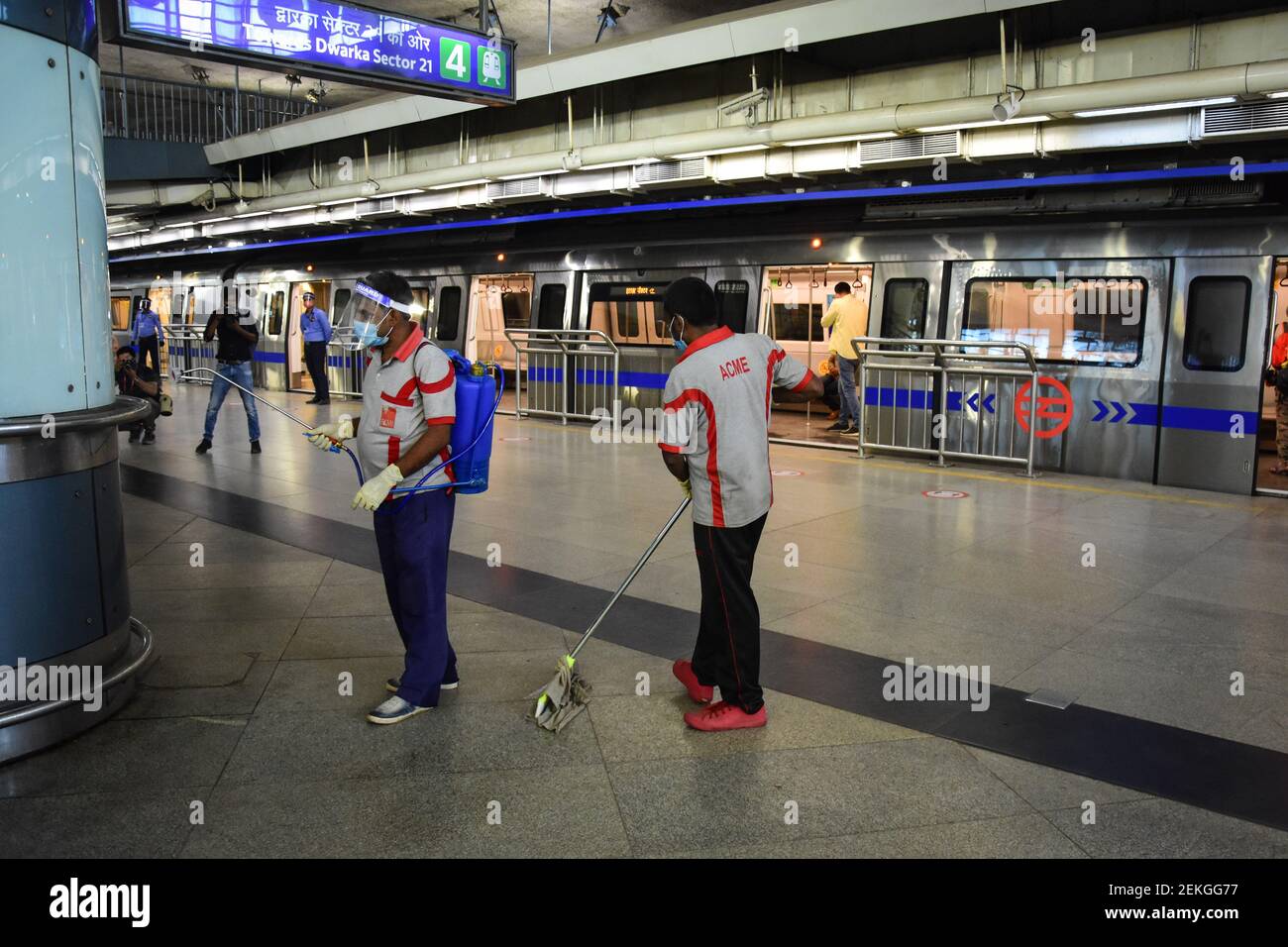 Delhi Metro Rail Corporation (DMRC) employees disinfect and clean the ...