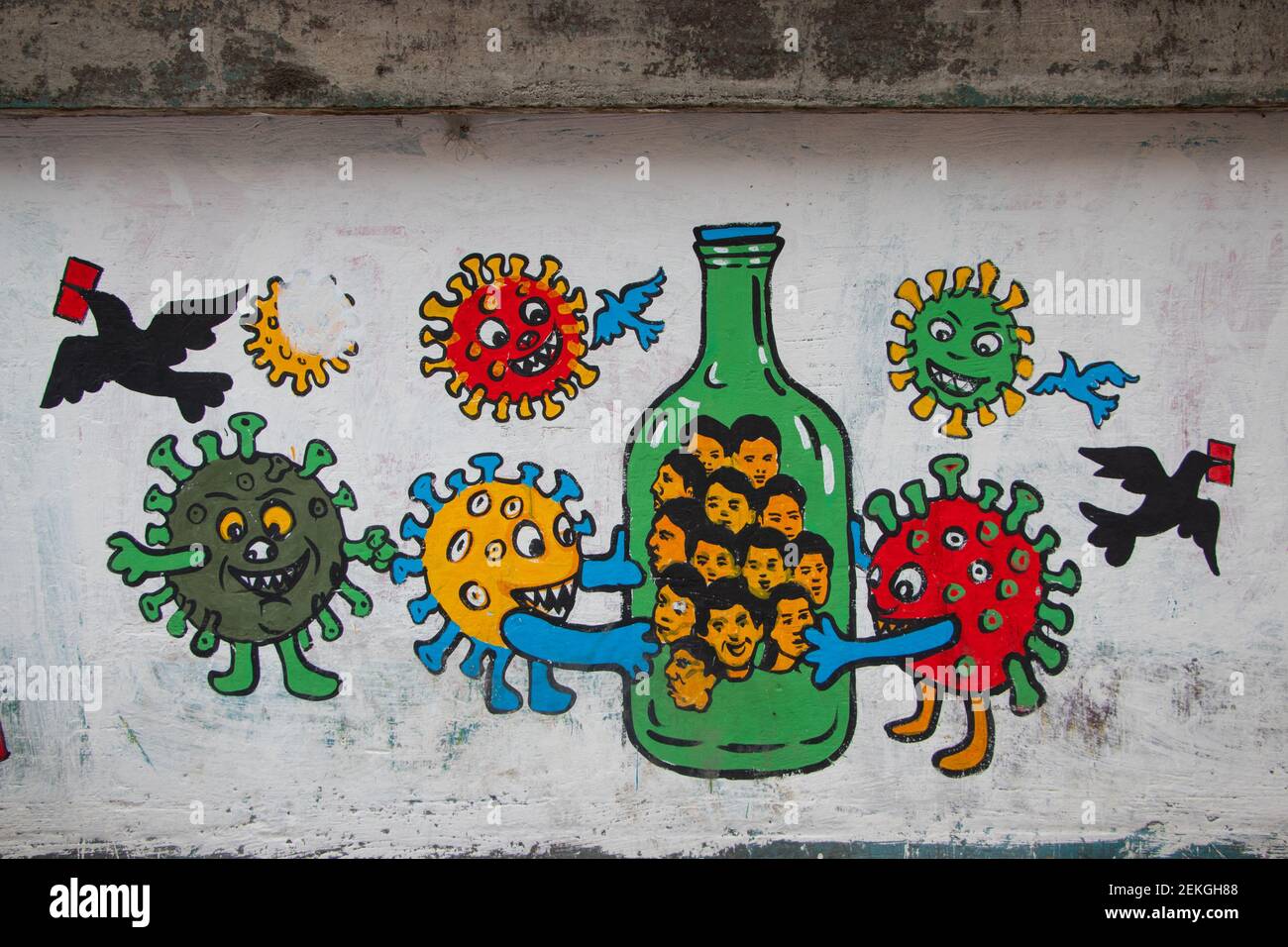 People cross over graffiti depicting awareness during the corona-virus ...