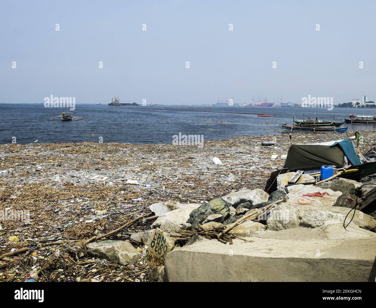 Heaps of various trash and waste lines up near the sewerage outfall of ...